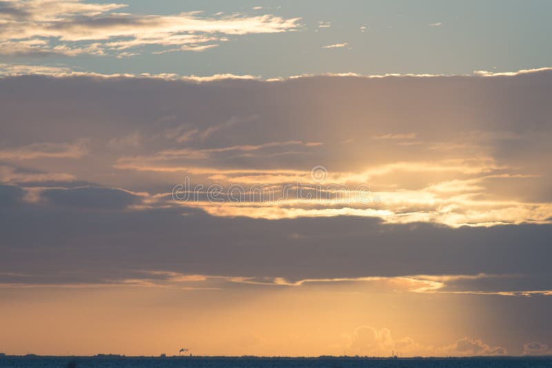 Breathtaking Scenery of the Sun Setting Behind the Clouds Creating the ...