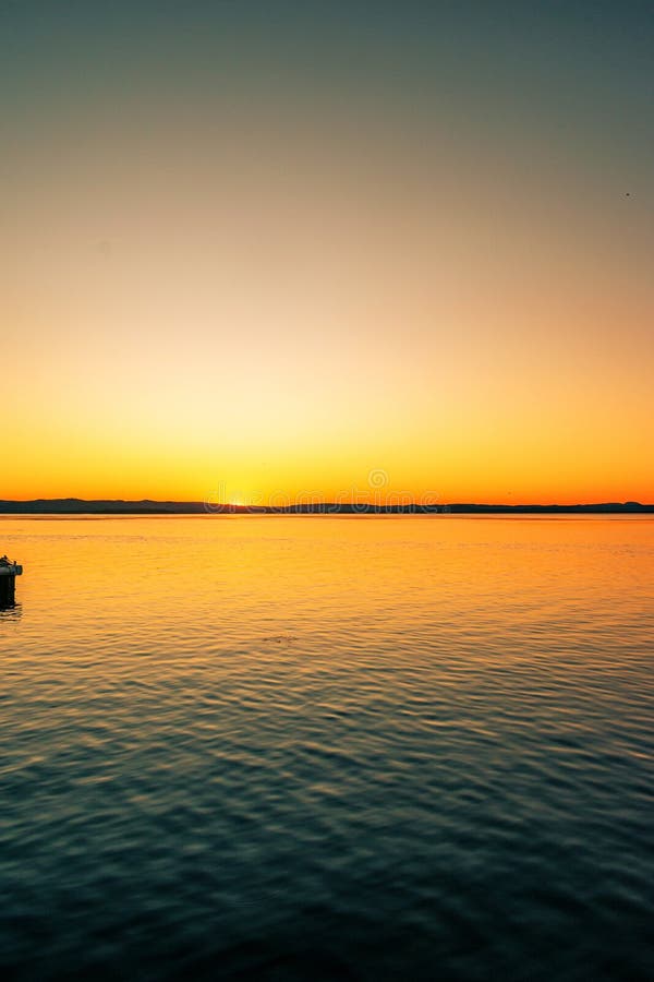 Breathtaking Scenery of the Sunset Sky Reflecting in the Peaceful Sea ...