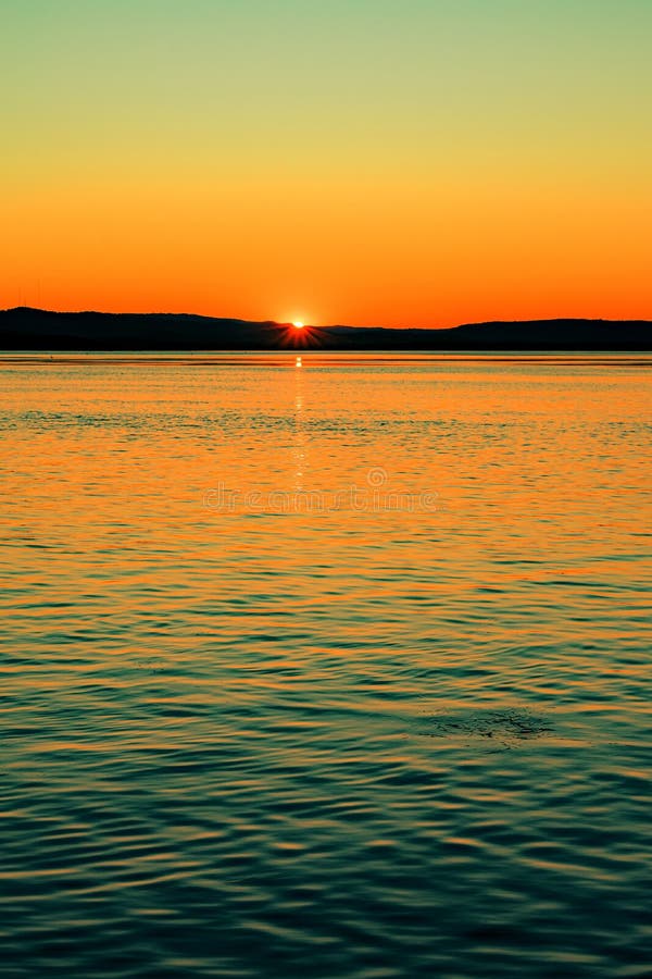 Breathtaking Scenery of the Sunset Sky Reflecting in the Peaceful Sea ...