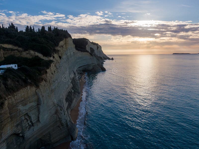 Sunset Over Dramatic Coastal Cliffs and Ocean. Serene Landscape with a ...