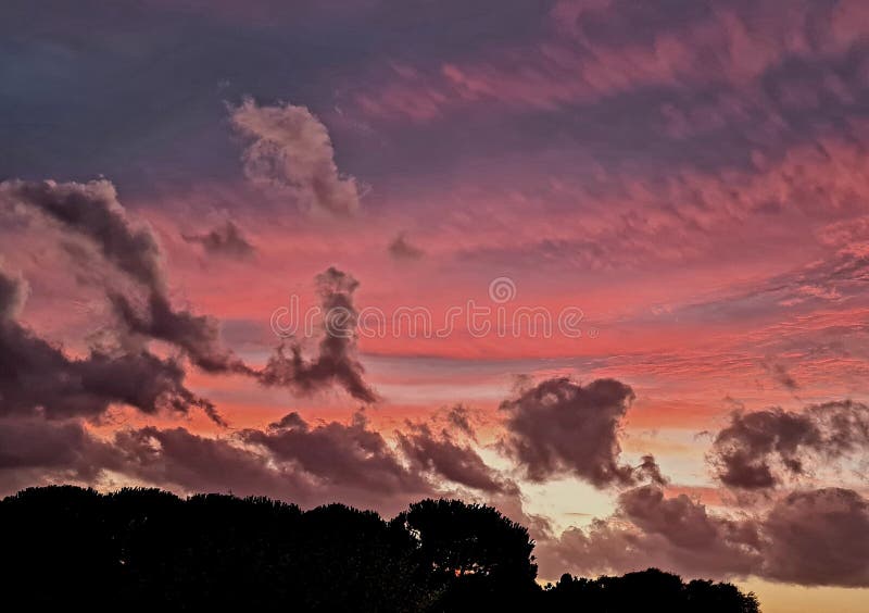 Breathtaking Sunset, with Scattered Clouds Flamed by the Burning Light ...