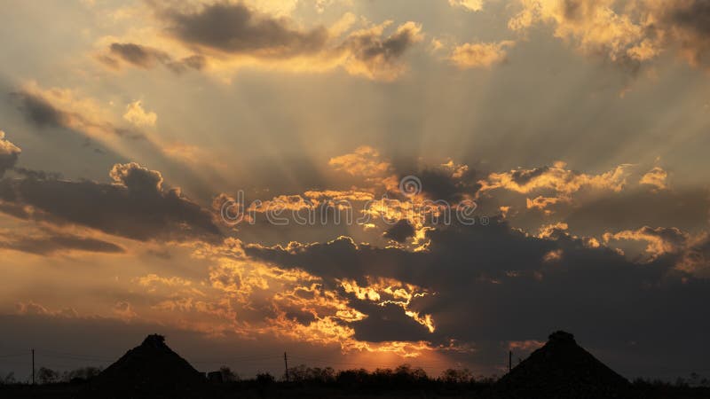 A Breathtaking Sunset with Vibrant Rays of Sunlight Piercing through ...