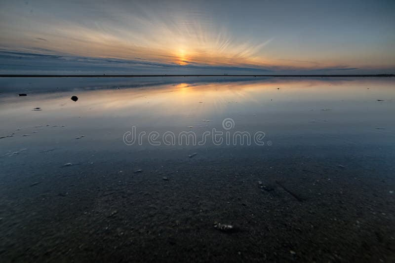 Breathtaking View of the Beach and the Ocean Under the Amazing Sunset ...
