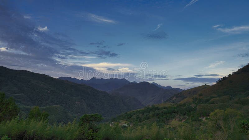 A Scenic View of a Mountain in the Distance with Clouds Stock Image ...