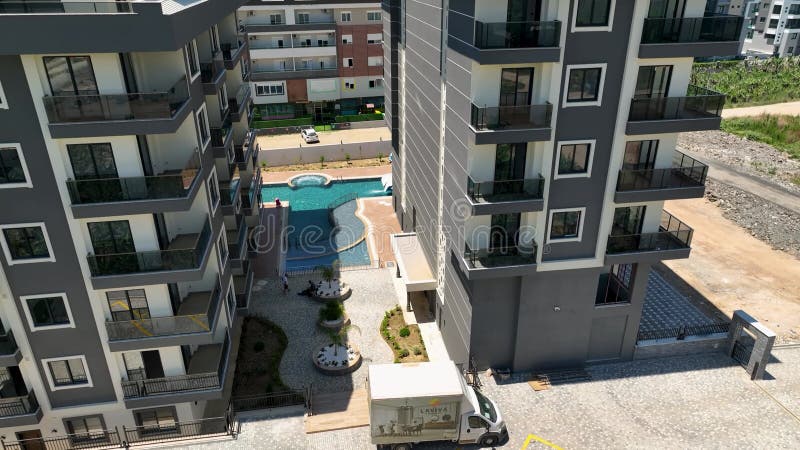 Aerial View: an Upscale Complex with a Crystal-clear Azure Pool, Lush ...