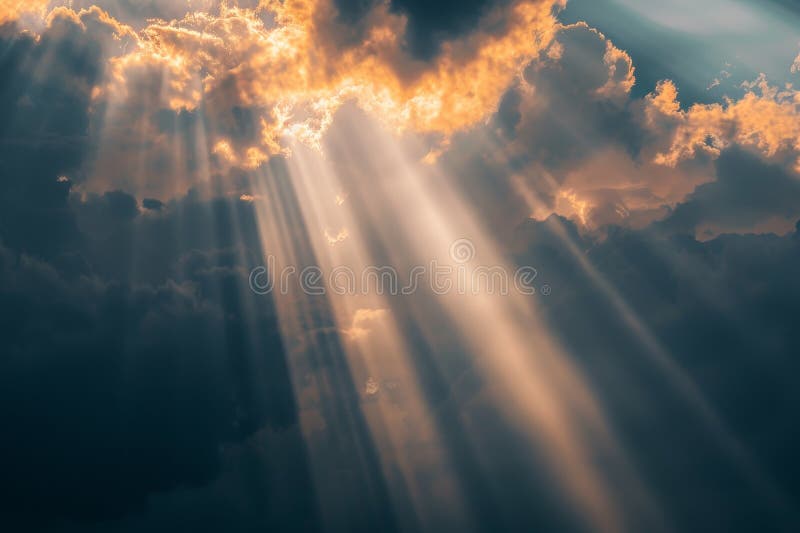 A Breathtaking View of Golden Light Rays Shining through Dark Clouds at ...