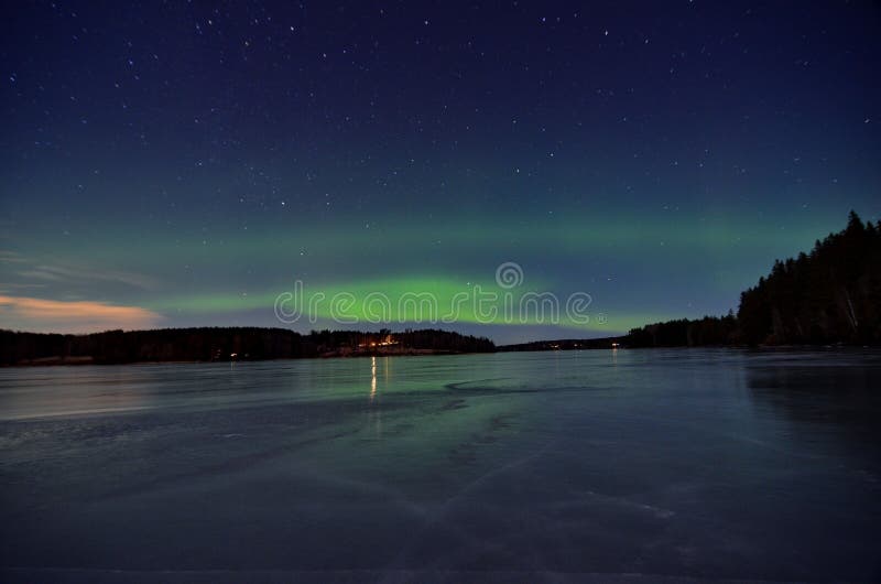 Breathtaking View of a Lake Illuminated by the Dramatic Aurora Borealis ...
