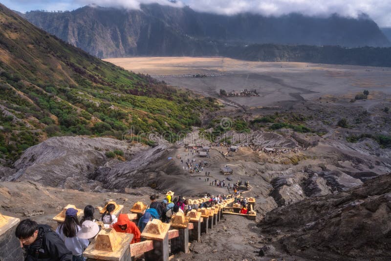 A Breathtaking View of Mount Bromo with Visitors Trekking Down the ...