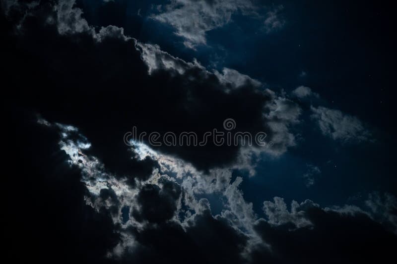 Breathtaking View of the Night Sky, Where Wispy Clouds Illuminated by ...