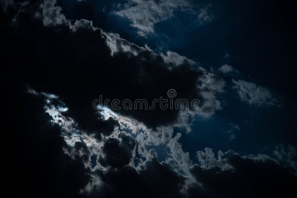 Breathtaking View of the Night Sky, Where Wispy Clouds Illuminated by ...