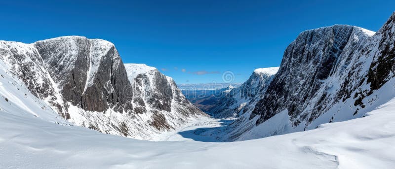 A Breathtaking View of a Snow-covered Mountain Range, with a Valley in ...