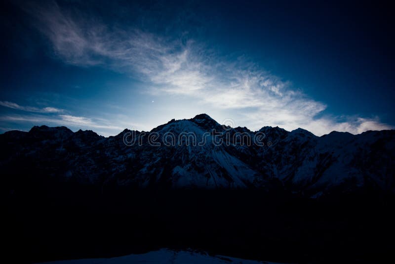 Breathtaking View of the Snow Covered Mountains Underneath the ...