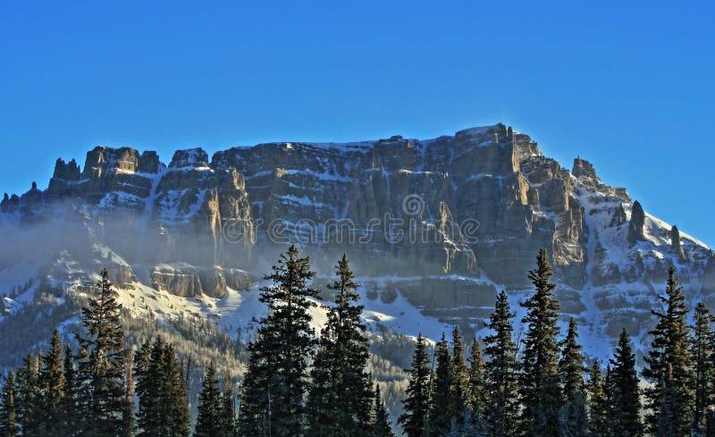 Breccia Cliffs - Snow Mist and Clouds Blowing Off Stock Photo - Image ...