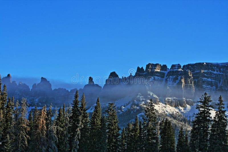 Breccia Cliffs - Snow Mist and Clouds Blowing Off Stock Photo - Image ...