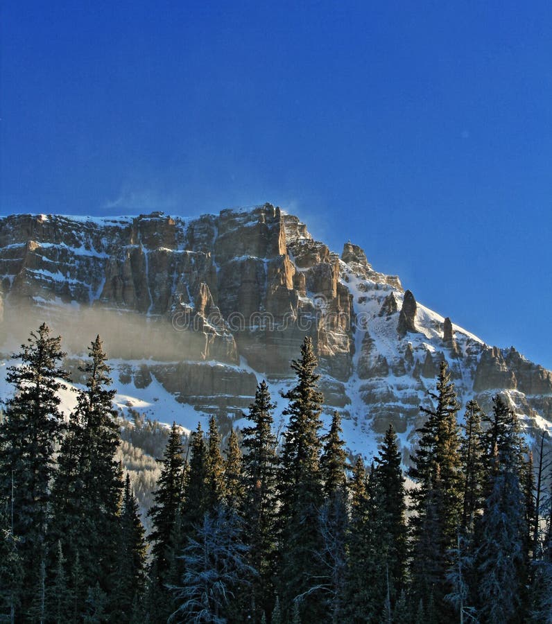 Breccia Cliffs - Snow Mist and Clouds Blowing Off Stock Image - Image ...