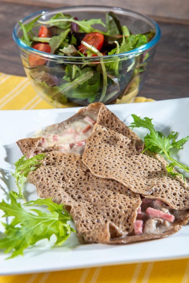 Breton Crepe with Cheese and Bacon in White Plate Stock Image - Image ...