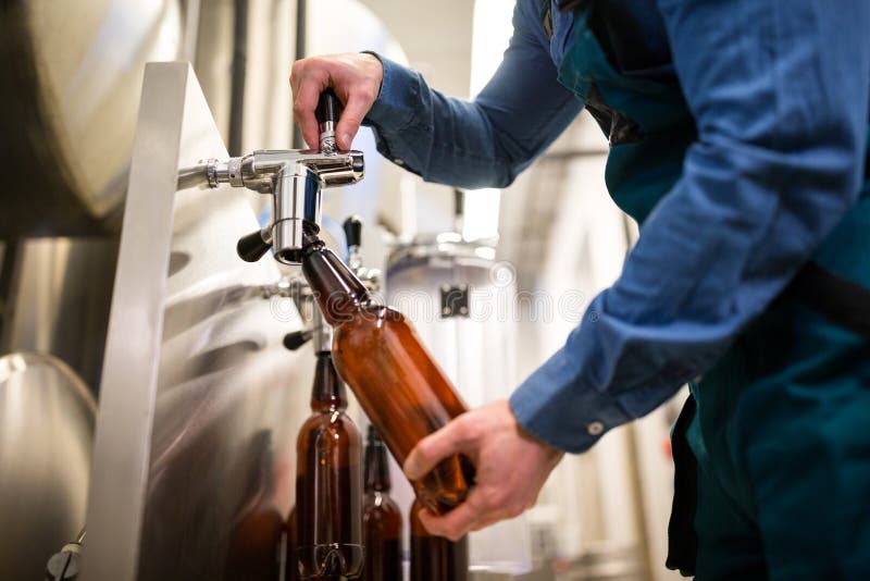 Brewer Filling Beer in Bottle Stock Image - Image of indoors, career ...