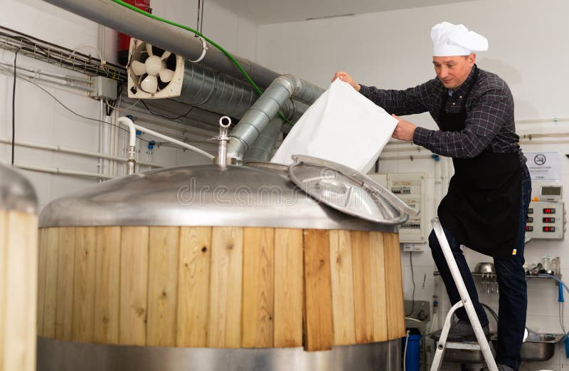 Brewer Pours Hops into Barrel for Brewing Beer Stock Photo - Image of ...