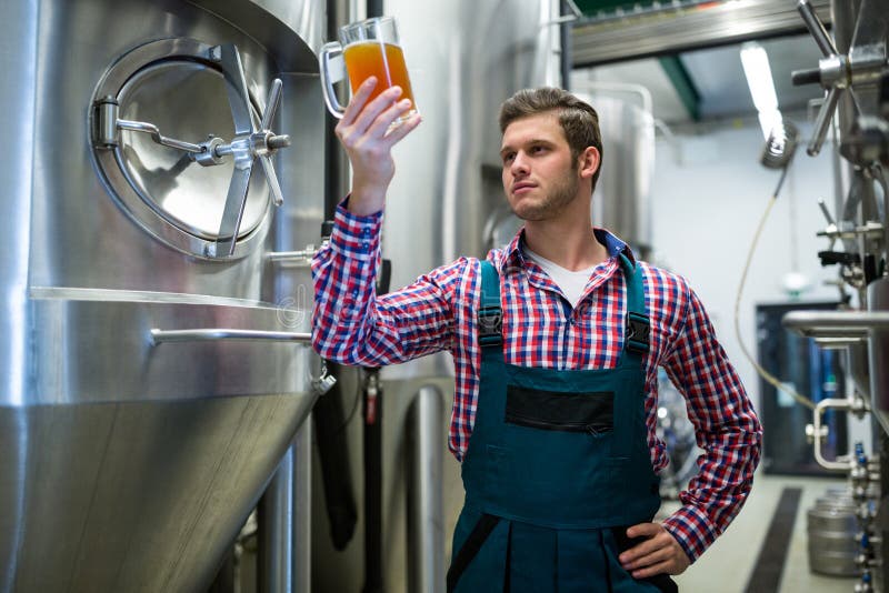 Brewer testing beer stock image. Image of distillery - 77694485