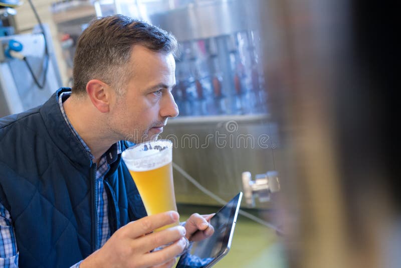 Brewer in Uniform Tasting Beer at Brewery Stock Photo - Image of ...