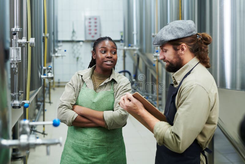 Brewery Worker Talking To Manager Stock Photo - Image of explain ...