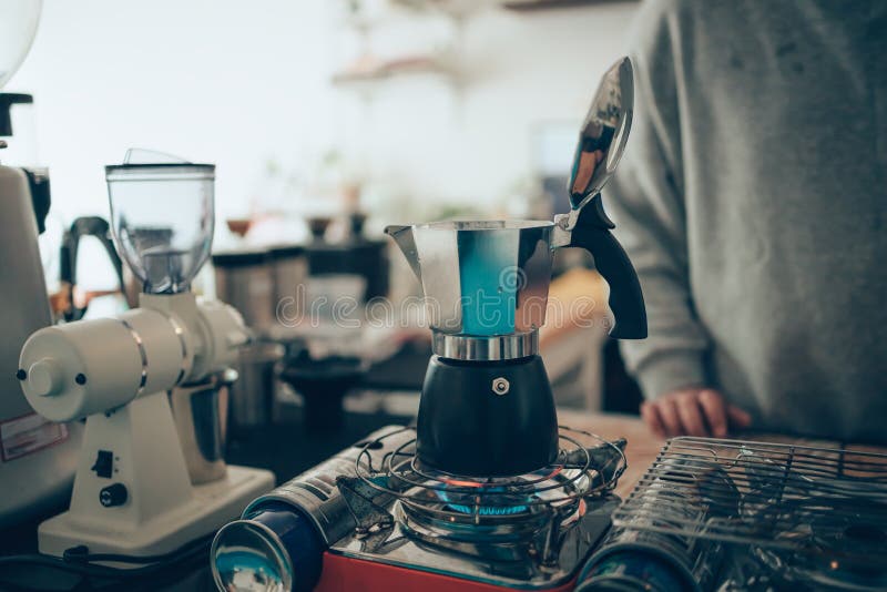 Brewing Black Moka Coffee Using Moka Coffee Maker and Boiling on Stove ...