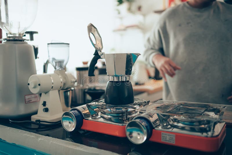 Brewing Black Moka Coffee Using Moka Coffee Maker and Boiling on Stove ...