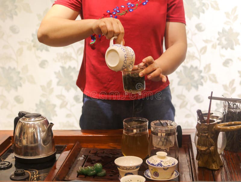 Brewing Chinese Tea from the Tea Leaves Stock Image - Image of wooden ...