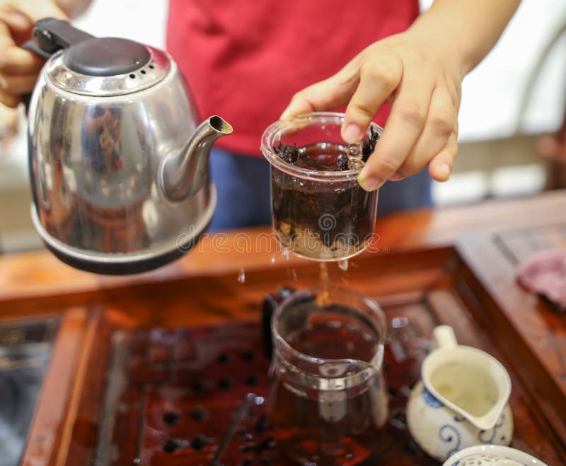 Brewing Chinese Tea from the Tea Leaves Stock Image - Image of glass ...