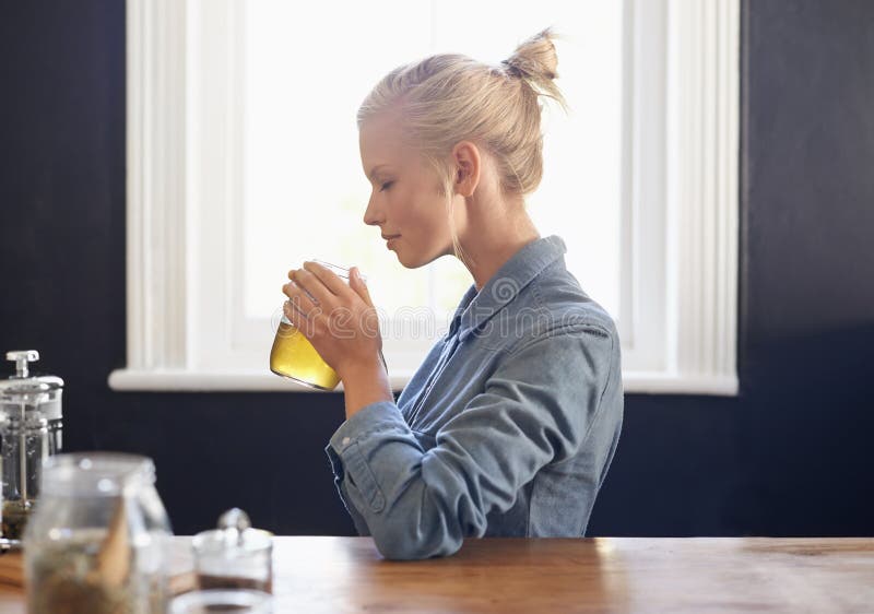 Brewing Some Herbal Tea. a Young Woman Making Herbal Tea. Stock Photo ...