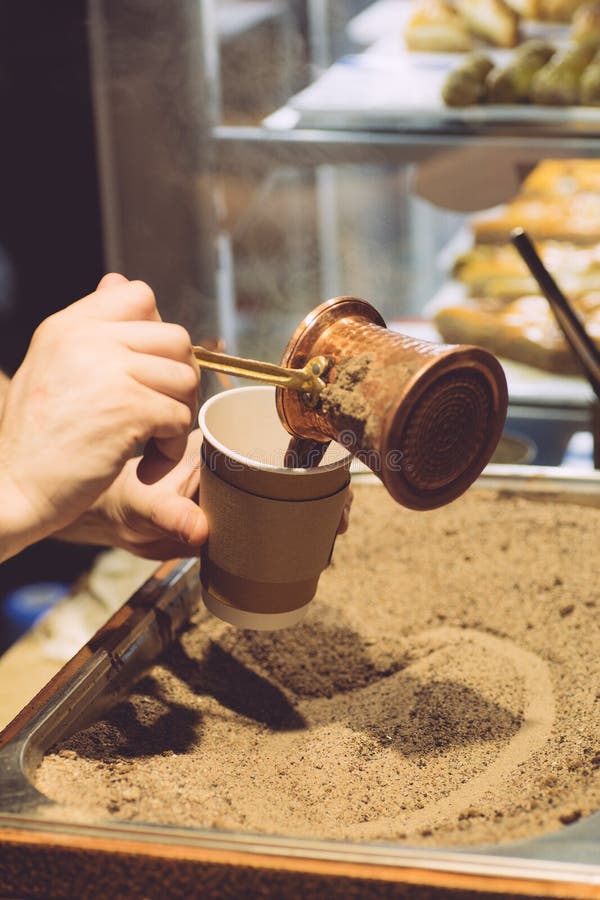 Brewing Turkish Coffee on Hot Sand. the Traditional Method of Making ...