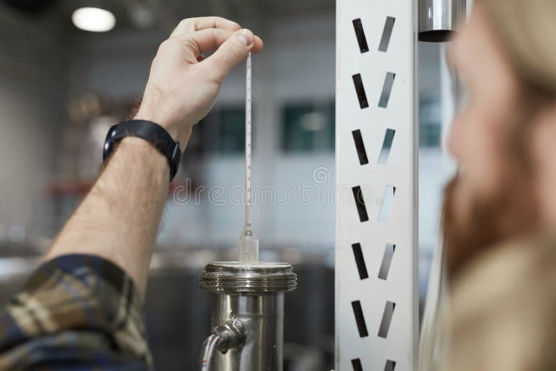 Brewmaster Using Alcometer stock photo. Image of industrial - 212595740