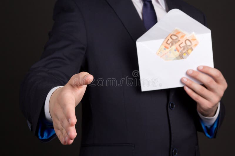 Bribery Concept - Man in Suit with Money in Envelope Ready To Ha Stock ...
