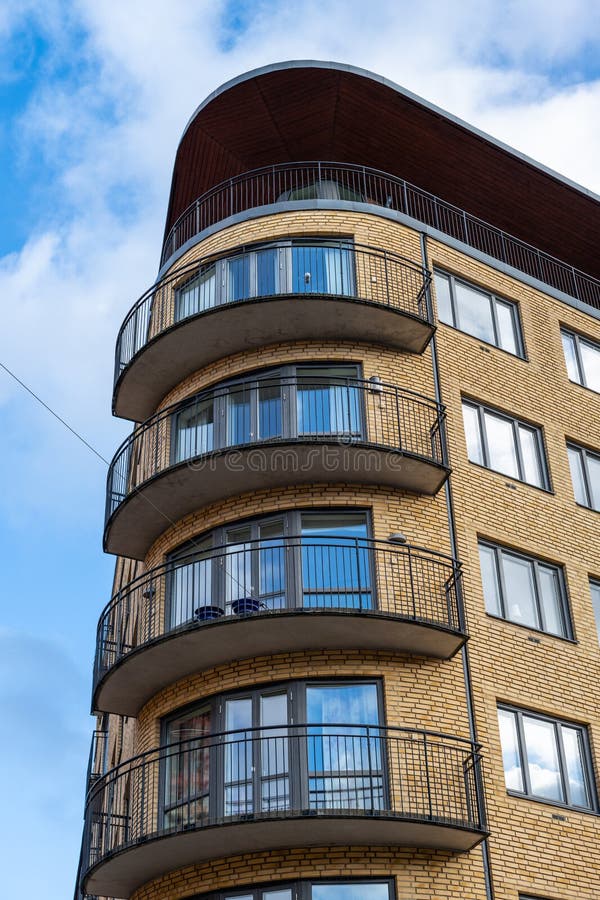 Brick Apartment Building with Retro Rounded Corner Windows and Balconys ...