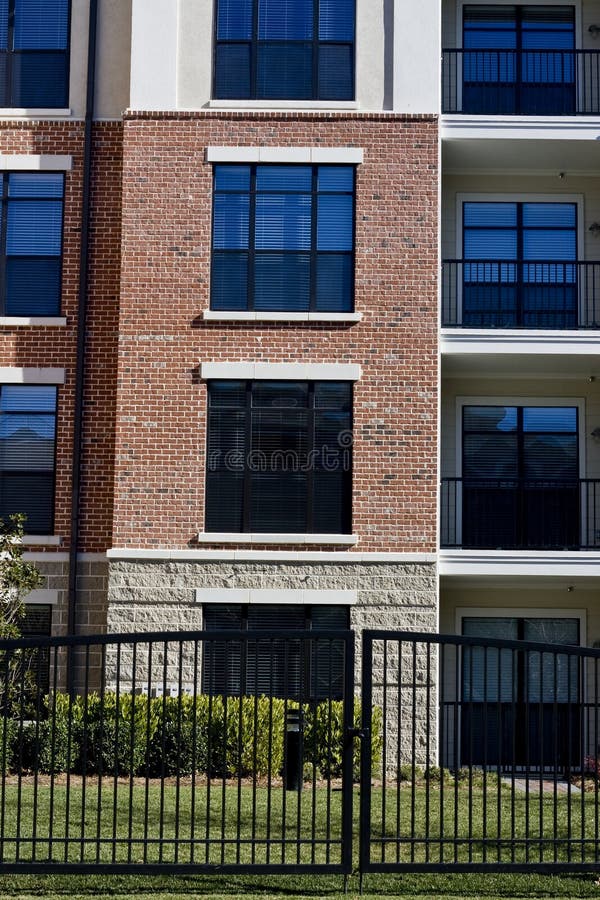 Brick And Balconies Behind Iron Gate Stock Image - Image of porch ...
