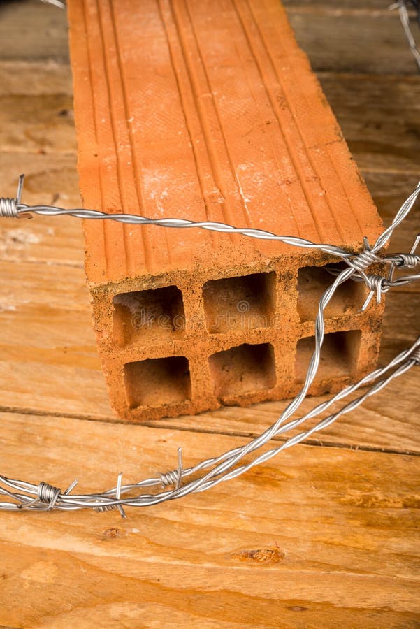 Brick and Barbed Wire: the Wall Stock Photo - Image of civil, brick ...