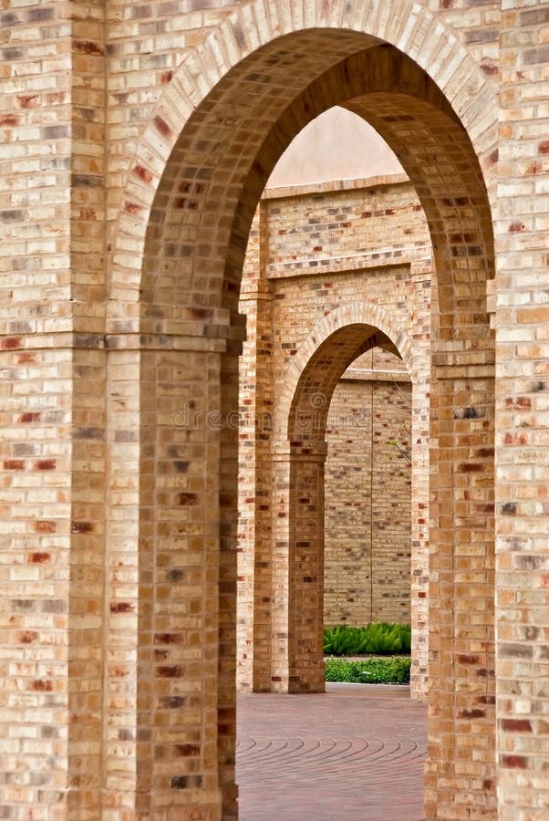 Brick building arches stock image. Image of yellow, pavement - 14005821