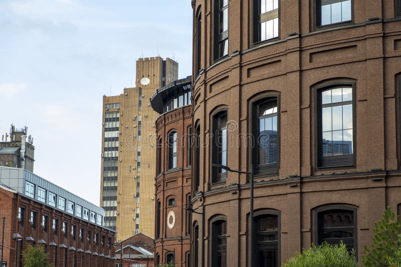 Brick Building with the Bottom, the Sky is Reflected in the Windows ...