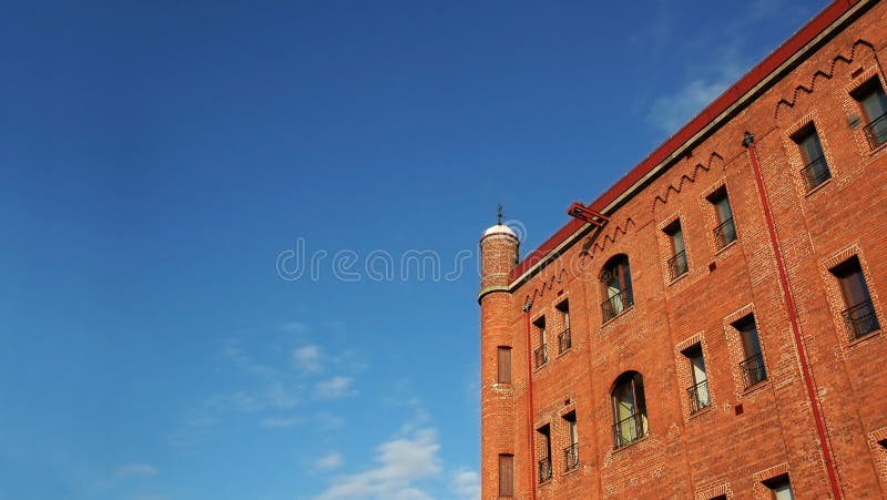 Brick Building and Clear Sky Stock Photo - Image of tower, blue: 1044866