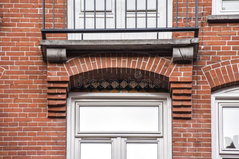 A Brick Building with a Window and a Balcony Editorial Image - Image of ...