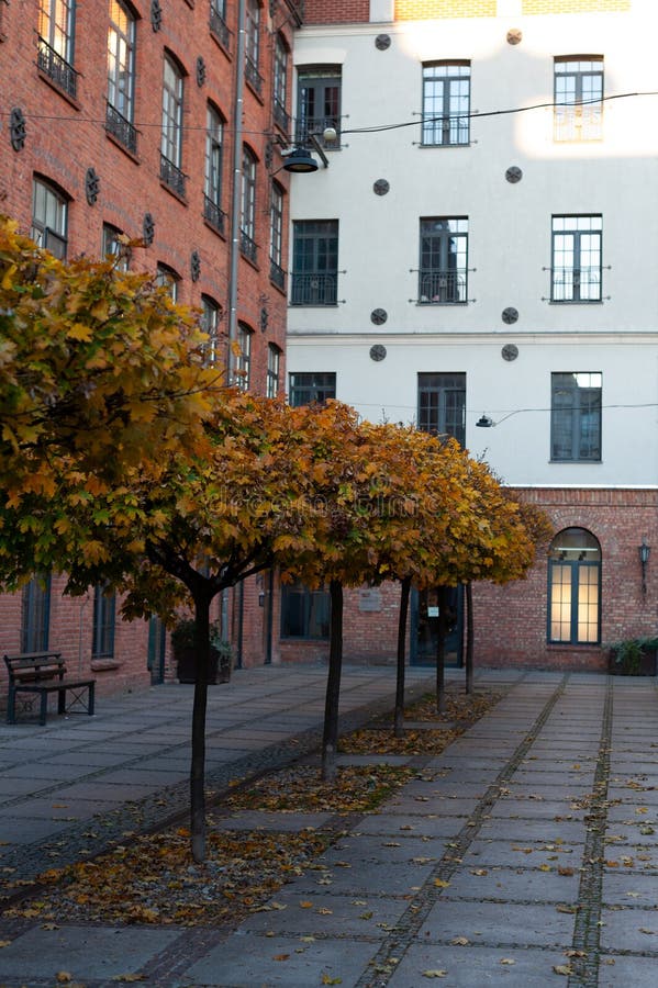 A Brick Building with a Courtyard in Front of it Editorial Stock Image ...