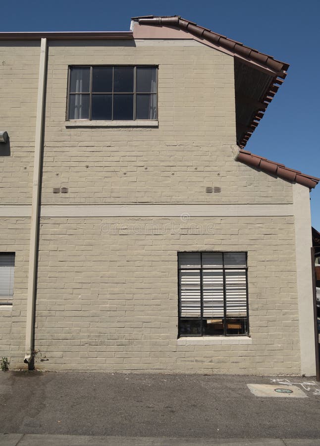Brick Building Exterior with Windows Stock Photo - Image of painted ...