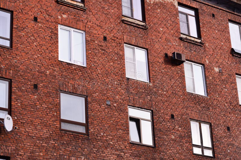 A Brick Building with Multiple Windows and a Satellite Dish, Suitable ...