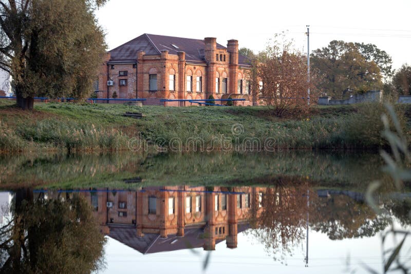 Brick Building Near the Water in Autumn Stock Photo - Image of castle ...