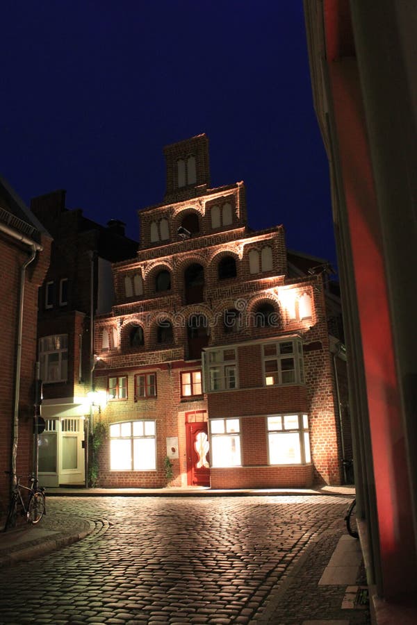 Brick building by night stock image. Image of lueneburg - 47137431