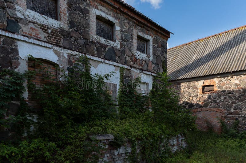 Brick Building of an Old Distillery Illuminated by Warm Sunlight in ...