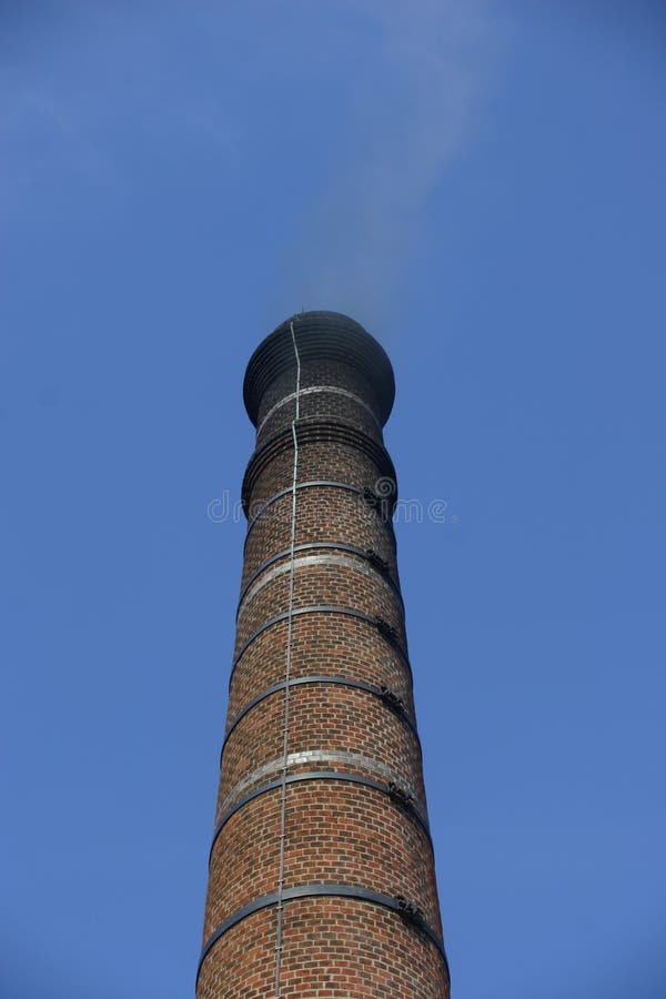 Tall brick chimney stock image. Image of smoke, burning - 57714799