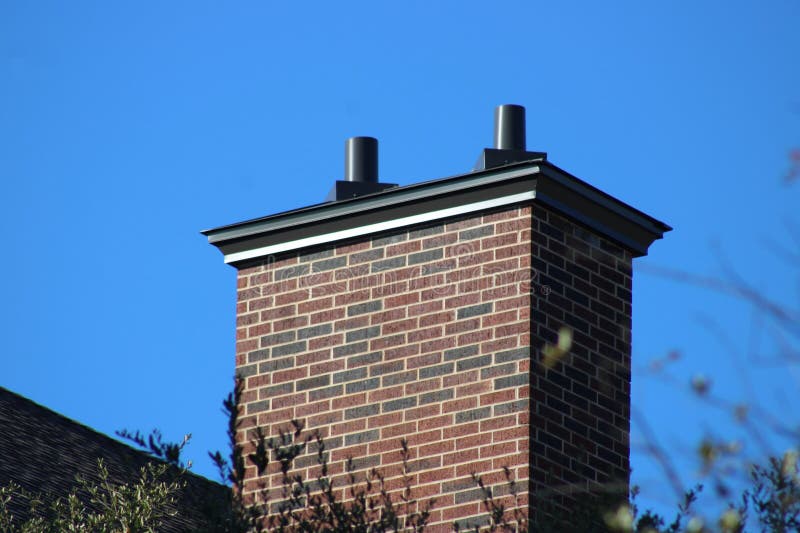 Brick Chimney with Flue Pipes Stock Photo - Image of flue ...
