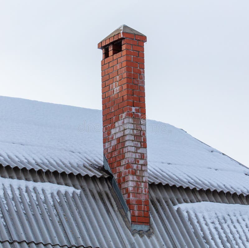 Brick Chimney on the Roof of a House in the Snow Stock Image - Image of ...
