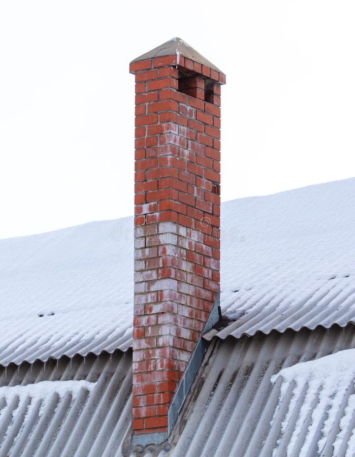 Brick Chimney on the Roof of a House in the Snow Stock Photo - Image of ...